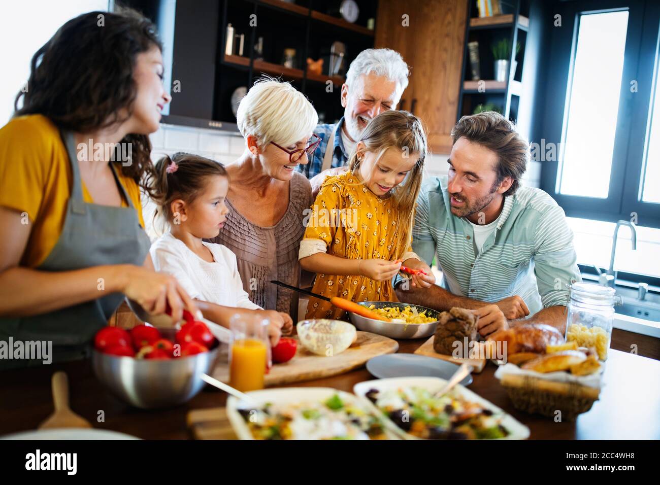 Happy family spending quality time together in the kichen Stock Photo ...