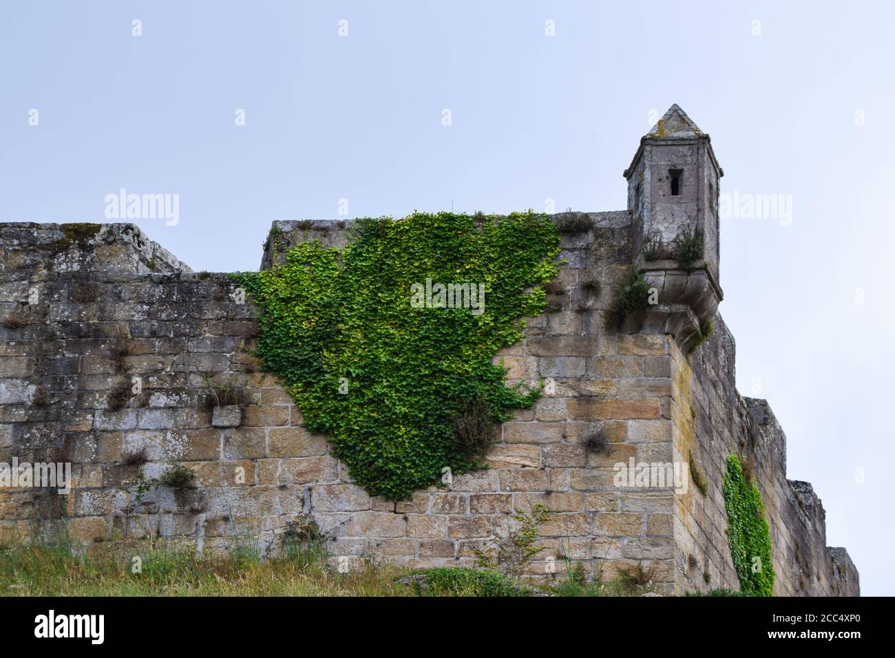 Watchtower and wall fortification of a castle Stock Photo - Alamy