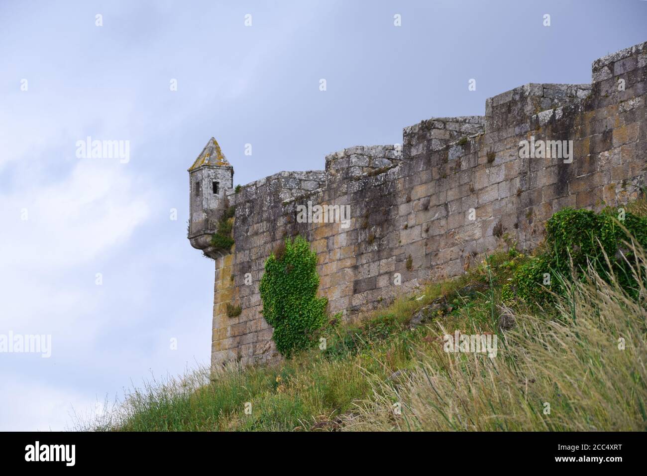 watchtower and stone wall of a castle Stock Photo - Alamy
