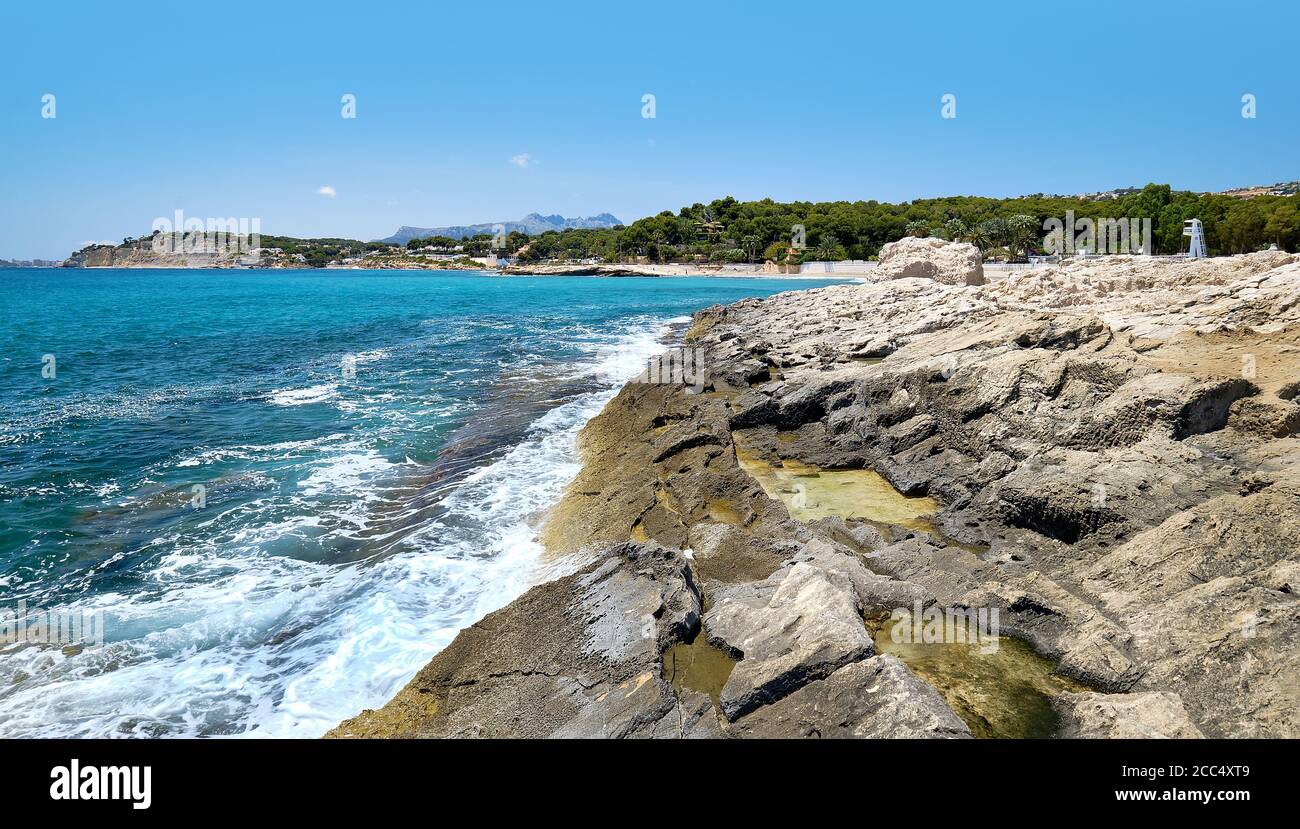 Beach of Moraira during sunny summer day, spanish coastal town. Spain ...