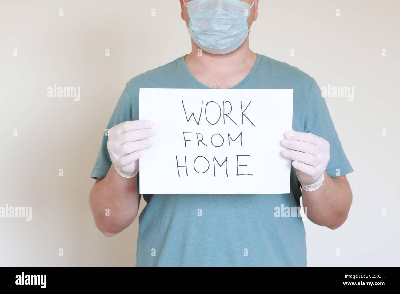 Doctor holding a Sign "Work from Home Stock Photo - Alamy