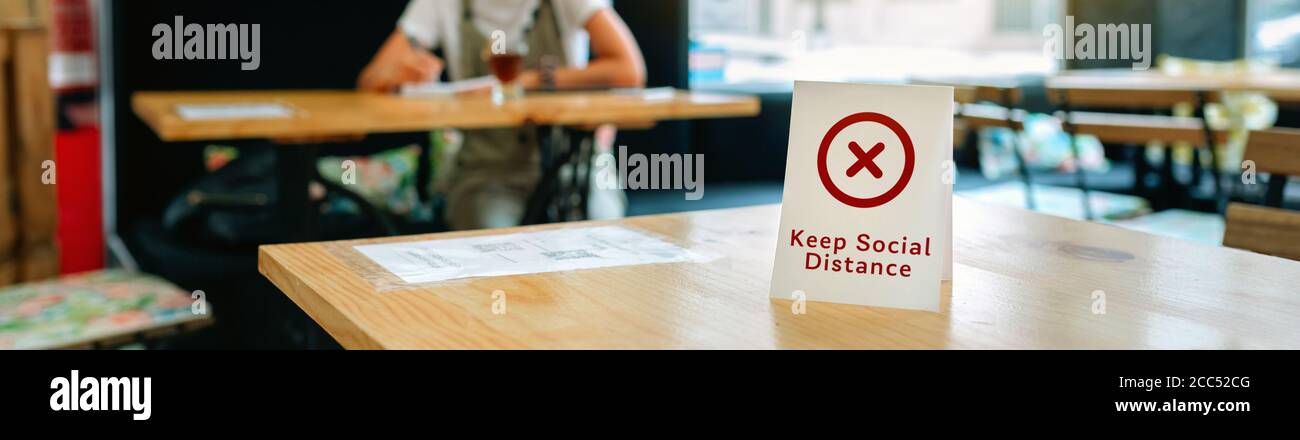 Coffee shop table with do not use sign Stock Photo - Alamy