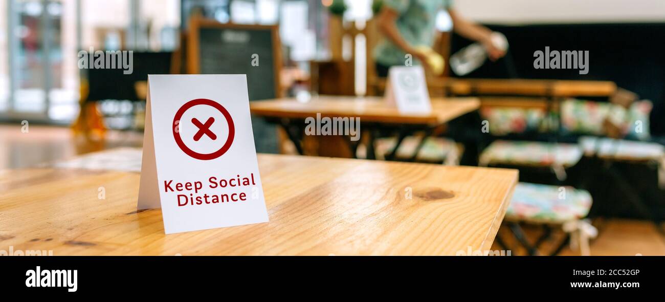 Coffee shop table with do not use sign Stock Photo - Alamy