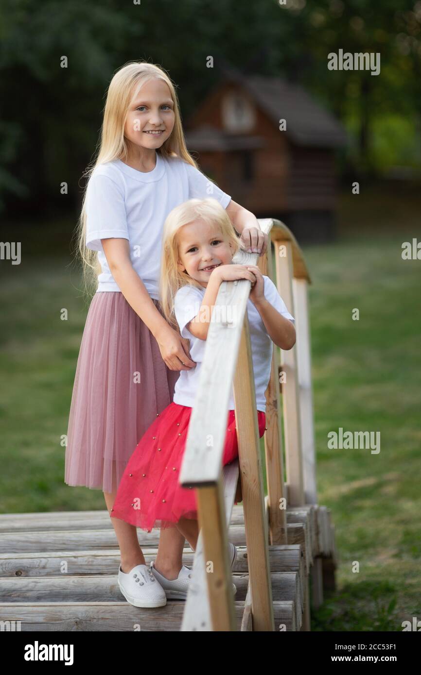 Two sisters standing outside in hi-res stock photography and images - Alamy