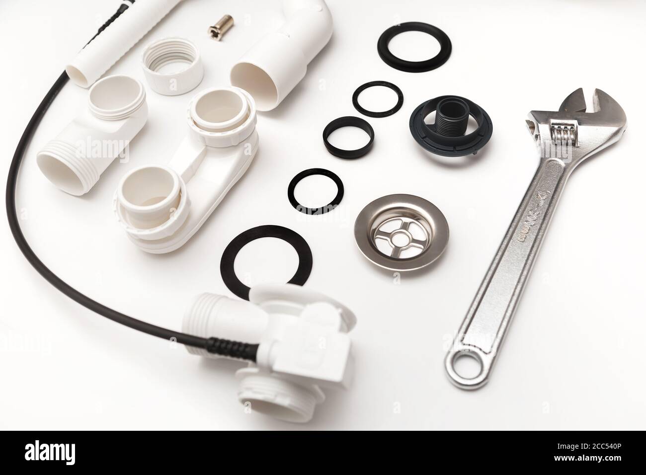 Details plastic siphon kit for bathtub on a white background. Plumbing ...