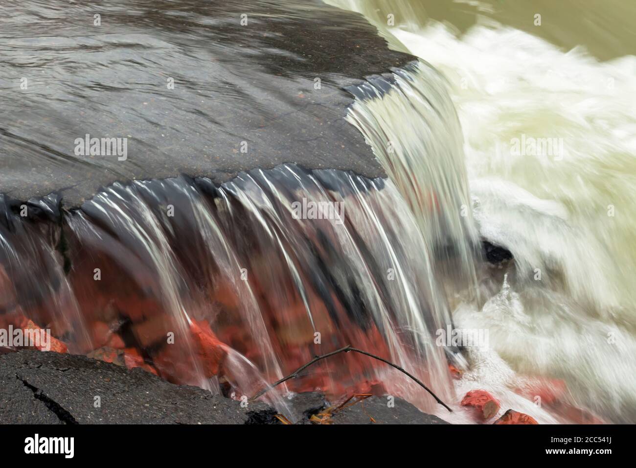flood water over flowing on the way Stock Photo - Alamy