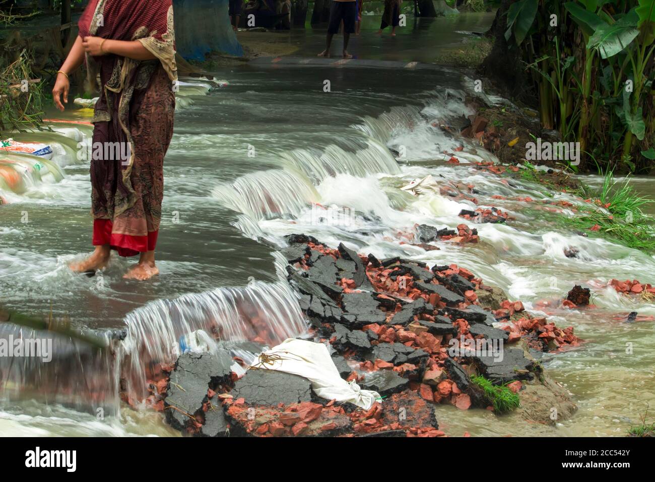 flood water over flowing on the way Stock Photo - Alamy