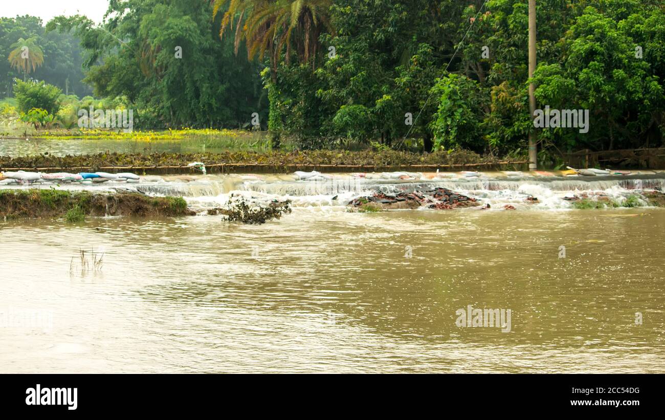 flood water over flowing on the way Stock Photo - Alamy