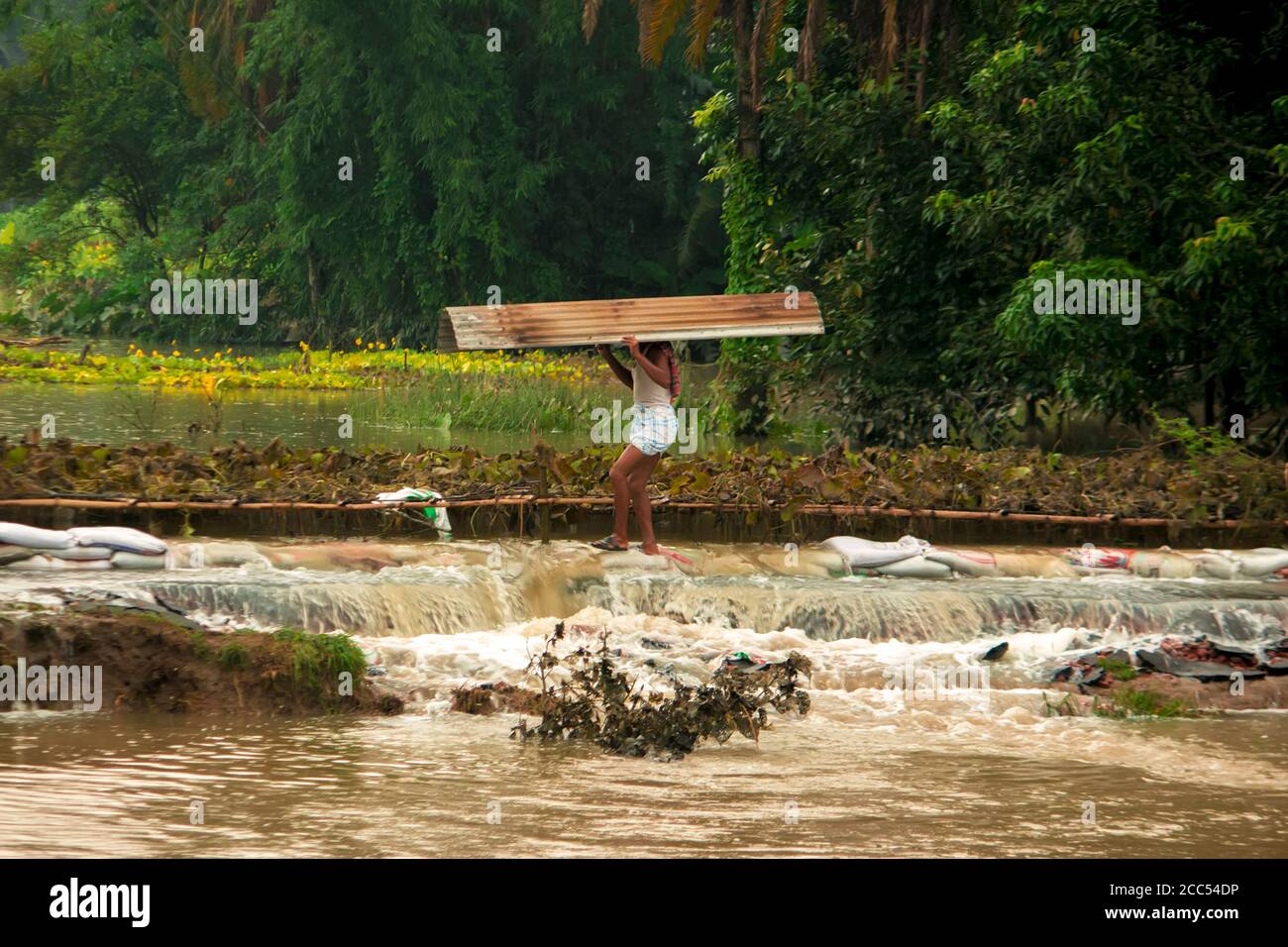 flood water over flowing on the way Stock Photo - Alamy