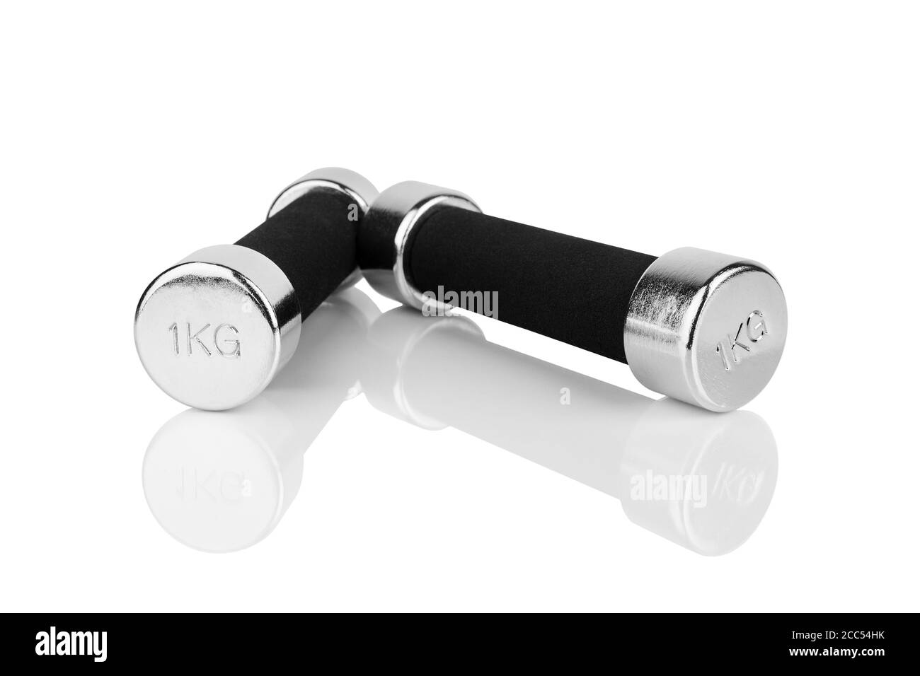 Two 1 kg dumbbells white background & reflection isolated close up ...