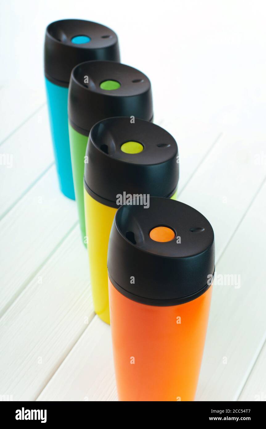 Color thermos mugs on the white background Stock Photo - Alamy