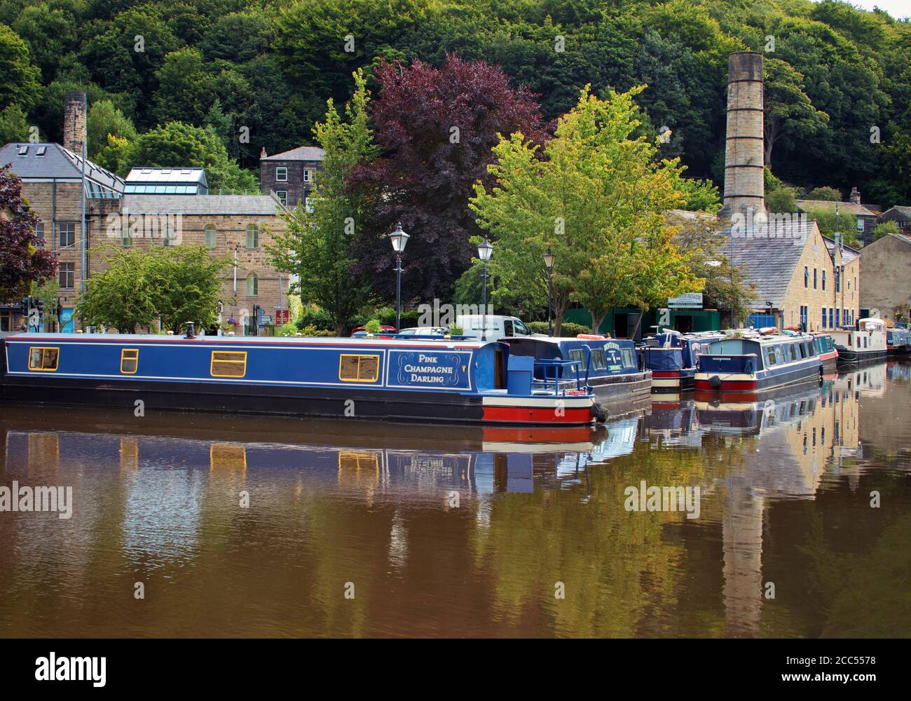Longboats and barges in the Rochdale Canal at Hebden Bridge, West ...
