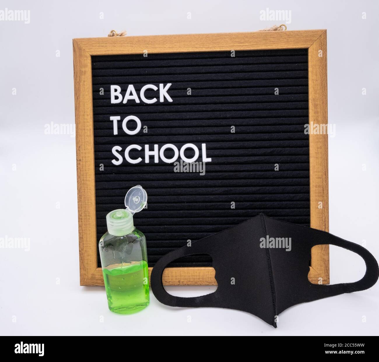 Back to school COVID-19 pandemic concept with lettering board hand gel ...