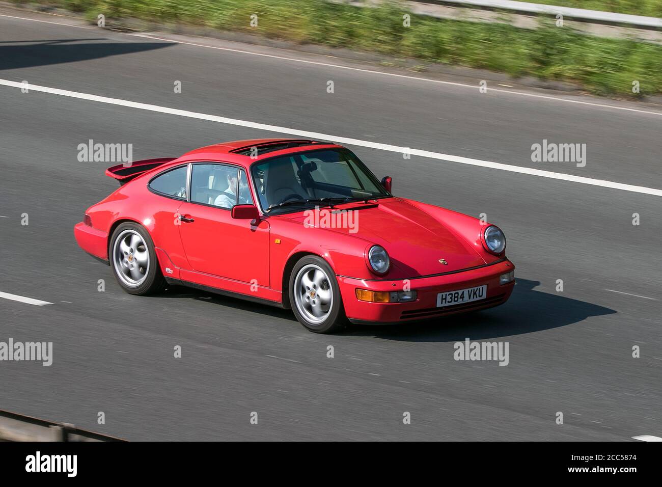 Porsche 911 Carrera Red Car Coupe Petrol driving on the M6 motorway ...