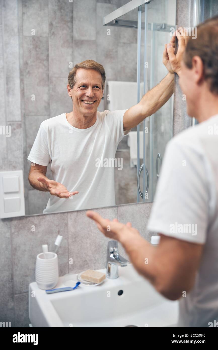 Good-looking middle-aged Caucasian man admiring his appearance Stock ...