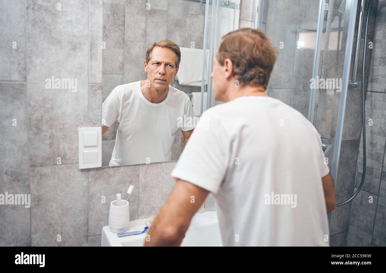 Blond man bathroom hi-res stock photography and images - Alamy