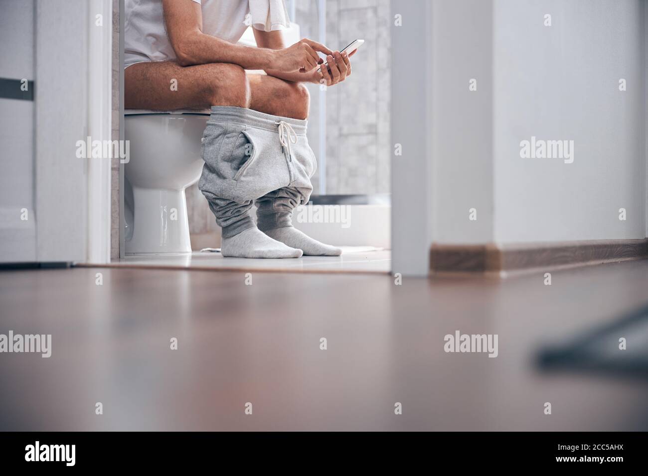 Man using toilet hi-res stock photography and images - Alamy