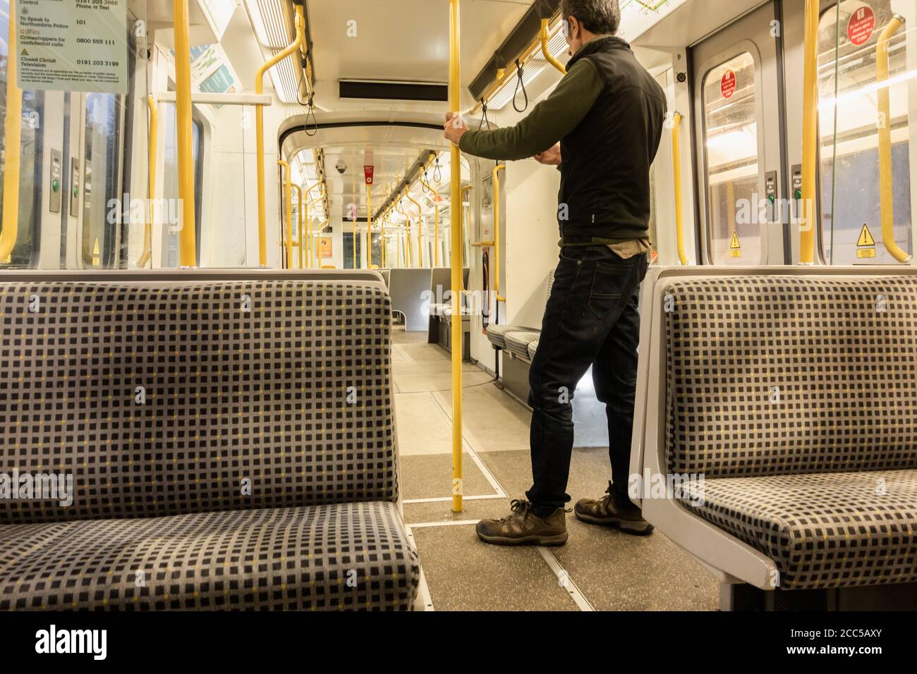 Man standing on an empty Metro train. UK Stock Photo - Alamy