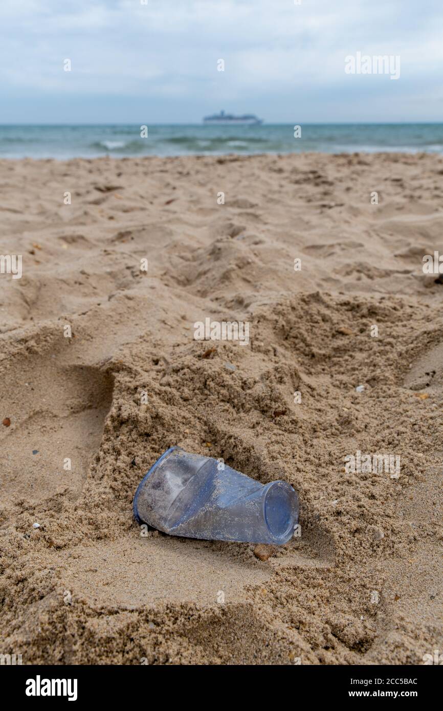 Plastic Pollution: Plastic cup left on the beach by tourists ...