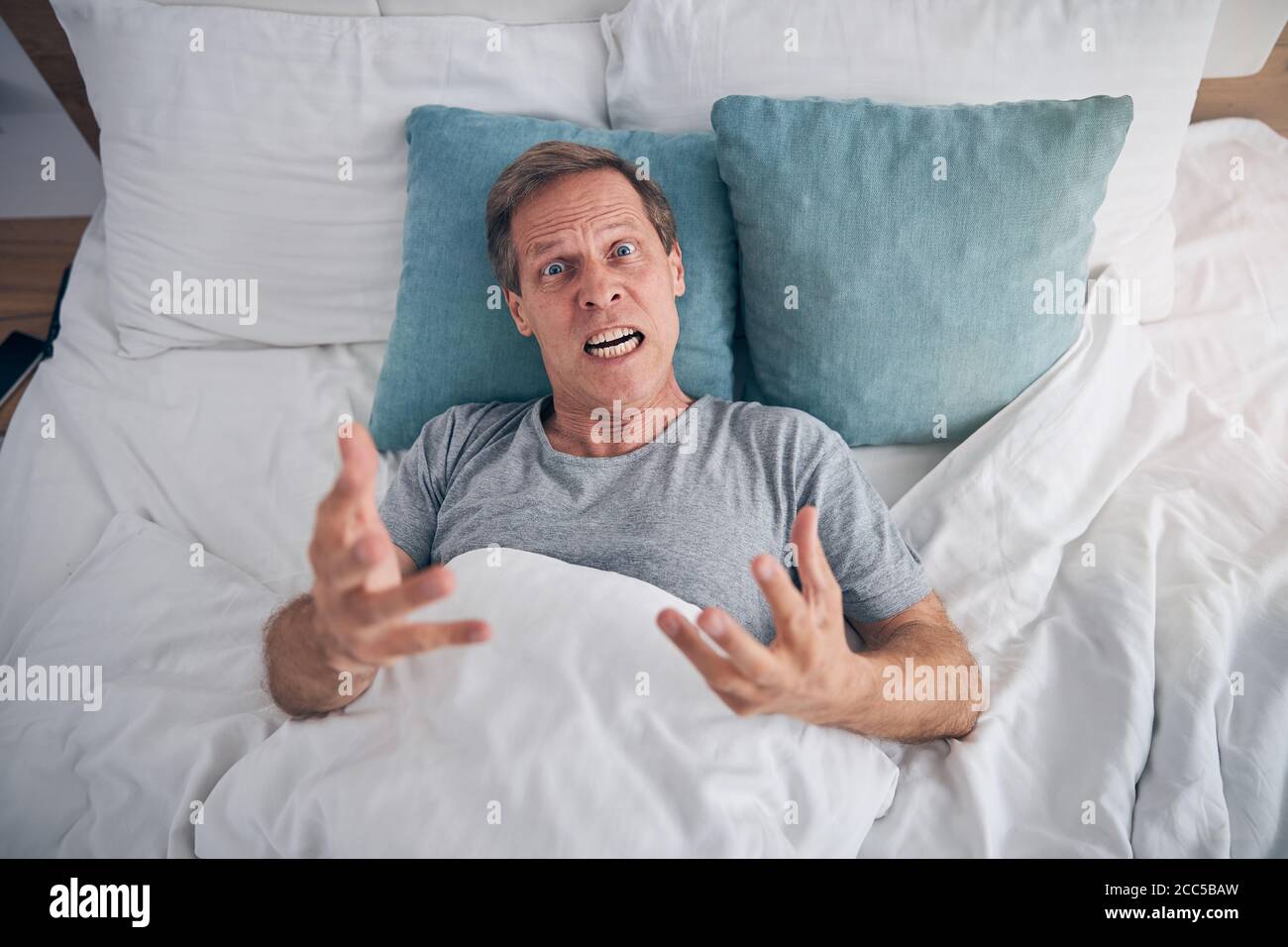 Angry mature male person staring at camera Stock Photo - Alamy