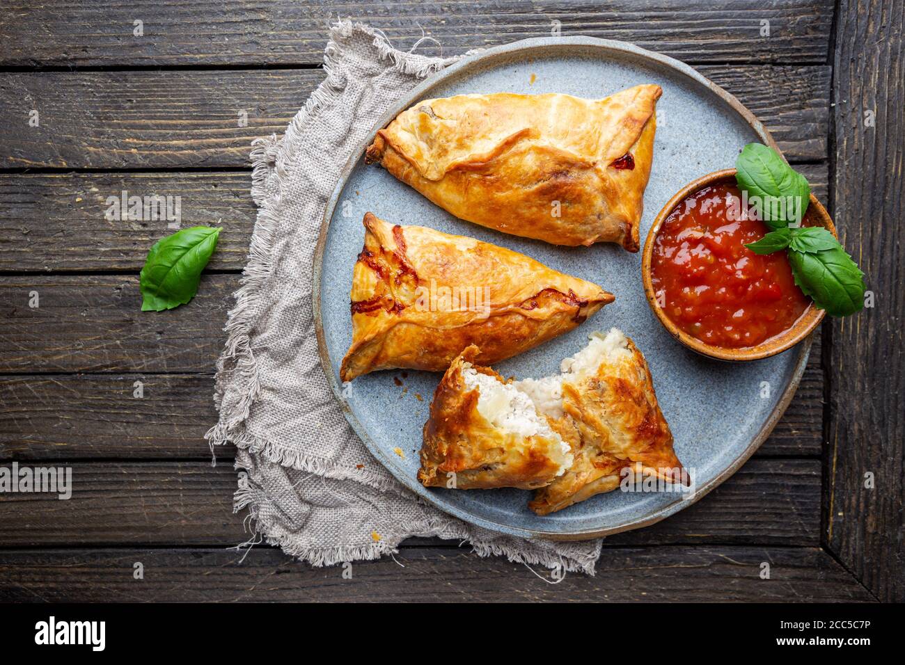 Asian food Samsa or samosas with chicken fillet on a plate. Top view ...