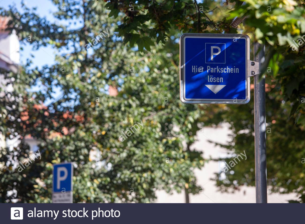 A blue parking sign in the town of Coburg indicating where people are ...