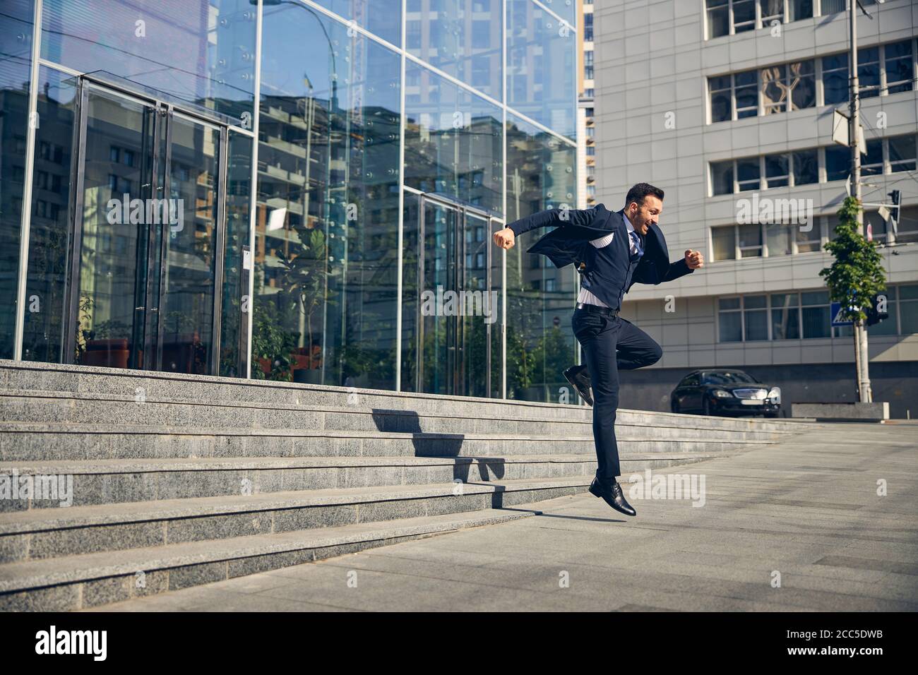 Hurrying into office building hi-res stock photography and images - Alamy