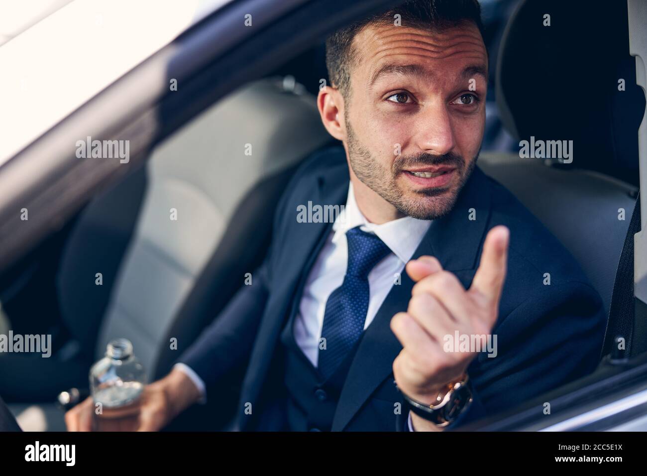 Emotional young man talking to his interlocutor Stock Photo - Alamy