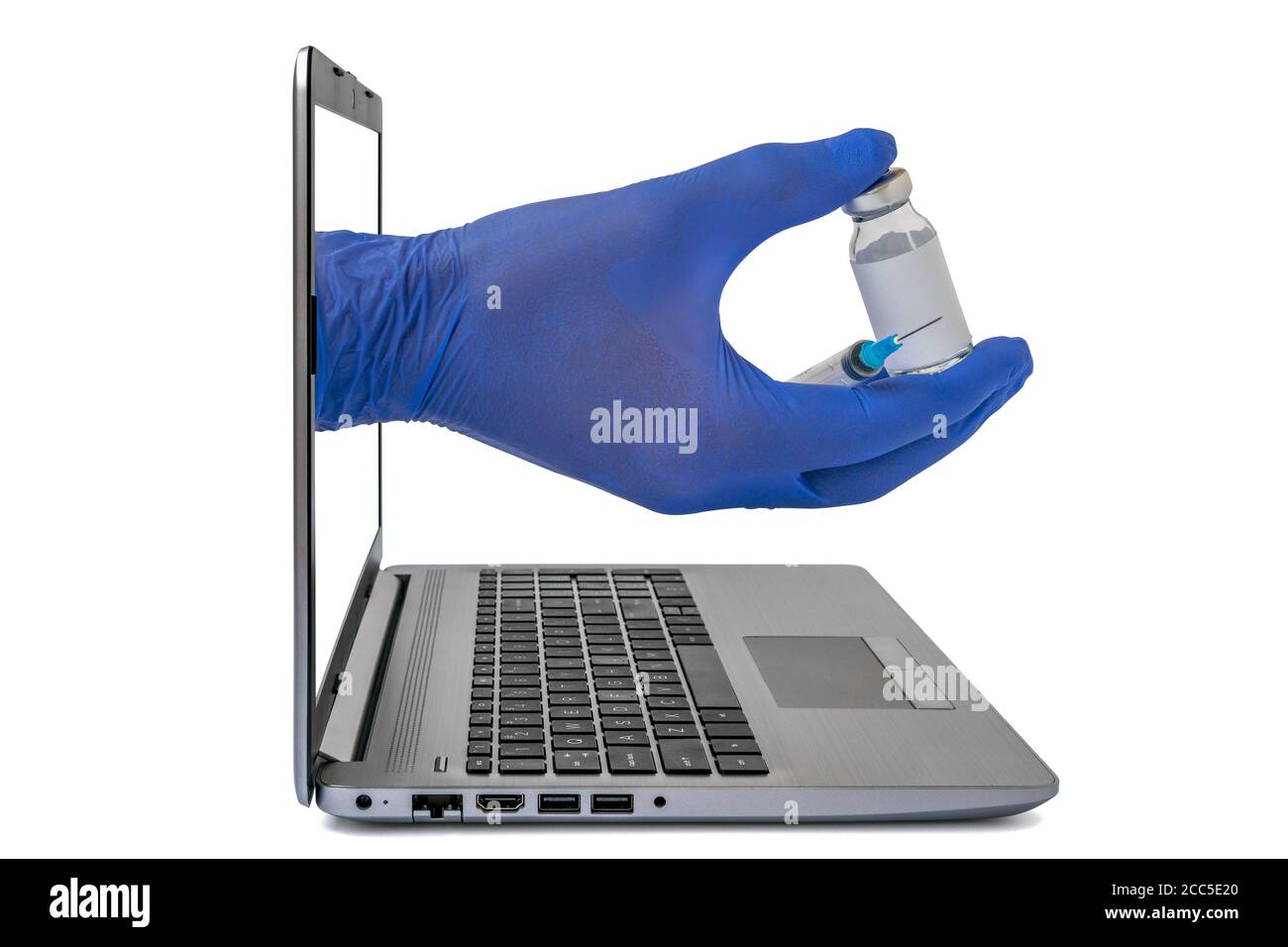 Technology And Medicine concept. Laptop computer and hand with a bottle ...