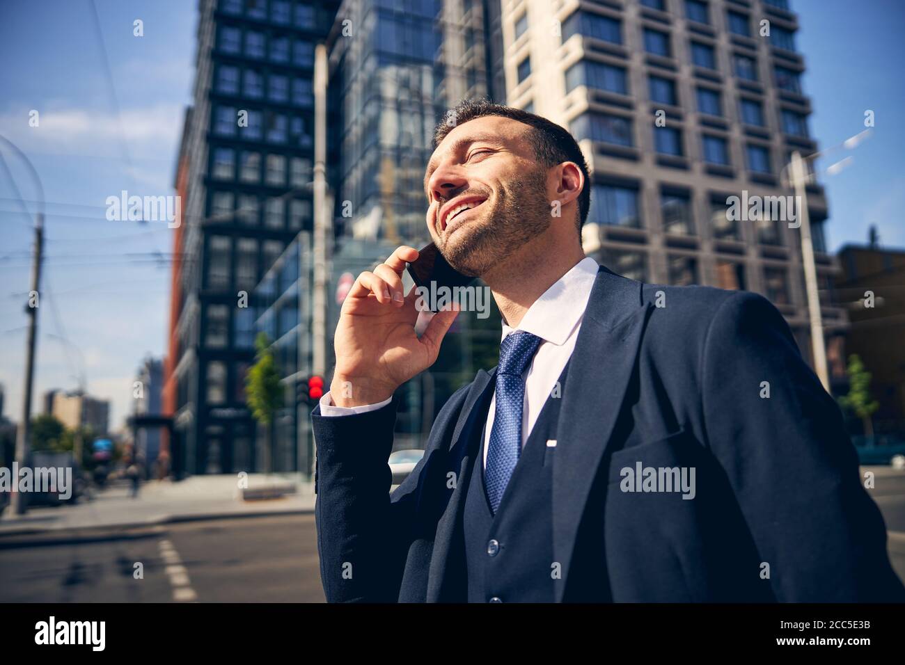 Positive delighted male person talking per telephone Stock Photo - Alamy
