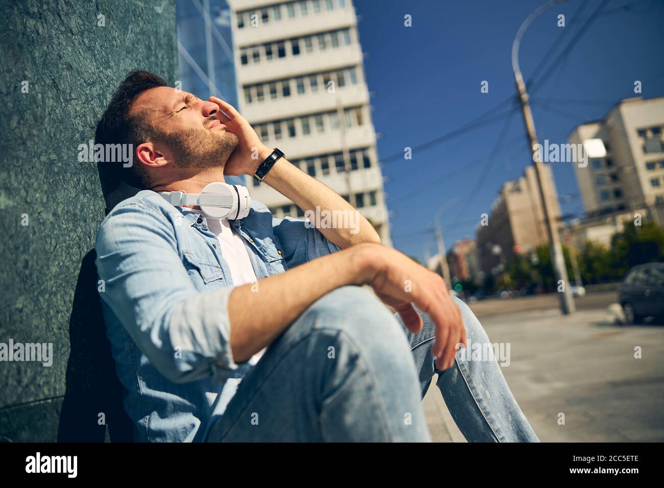 Emotional male person being deep in his thoughts Stock Photo - Alamy