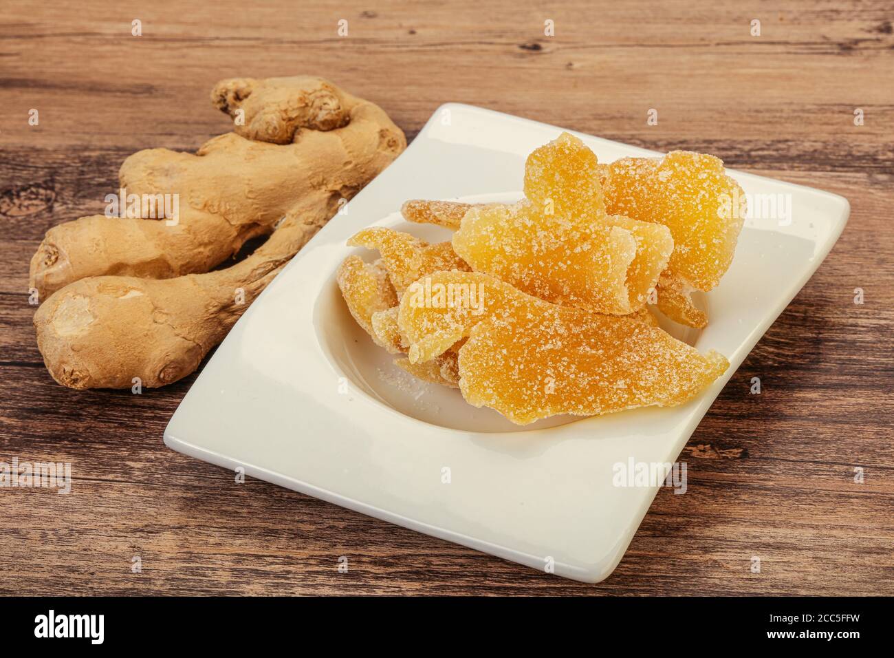 Dry sweet ginger snack in the bowl Stock Photo - Alamy