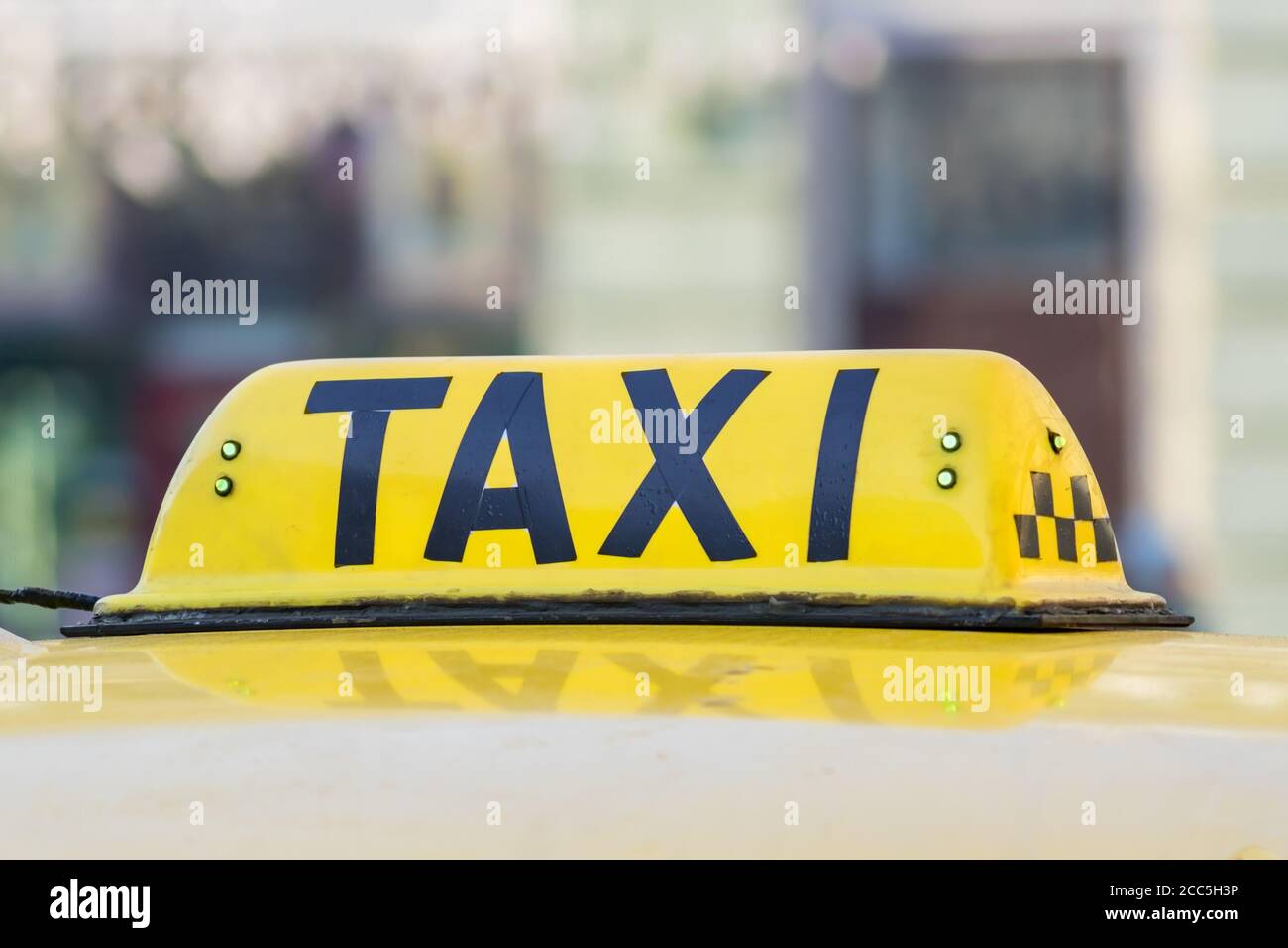 Yellow taxi sign. Taxi car on the street Stock Photo - Alamy