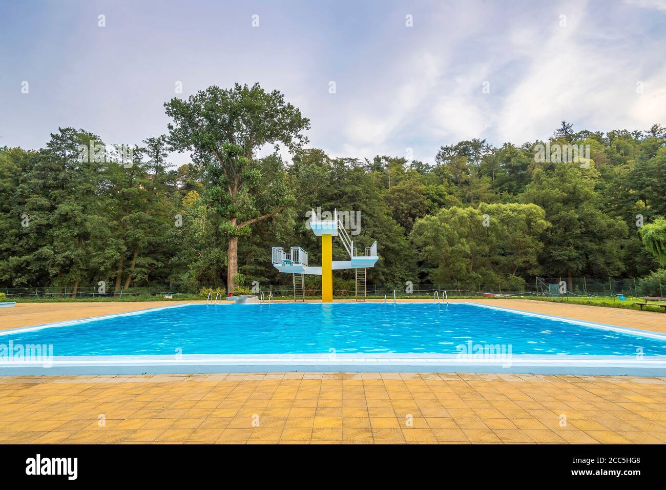 vacant outdoor swimming pool with diving tower Stock Photo - Alamy