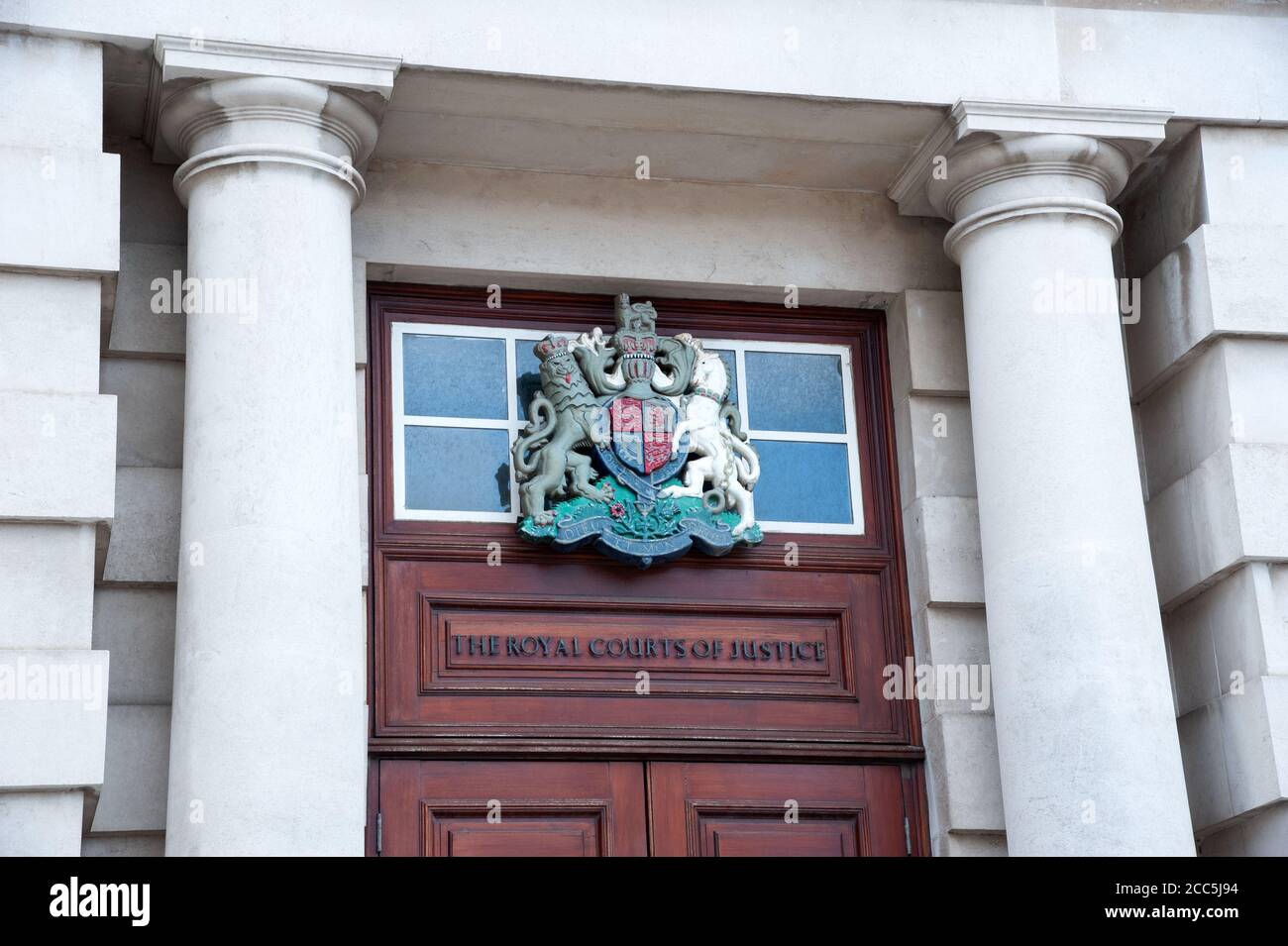 Royal coat of arms above the door of the Royal Courts of Justice ...