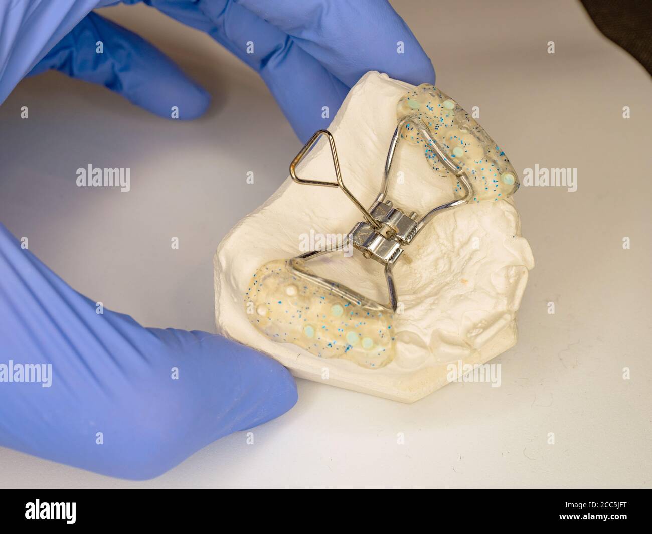 Dentist workshop. Doctor measure dental braces. Retainer adjustable ...