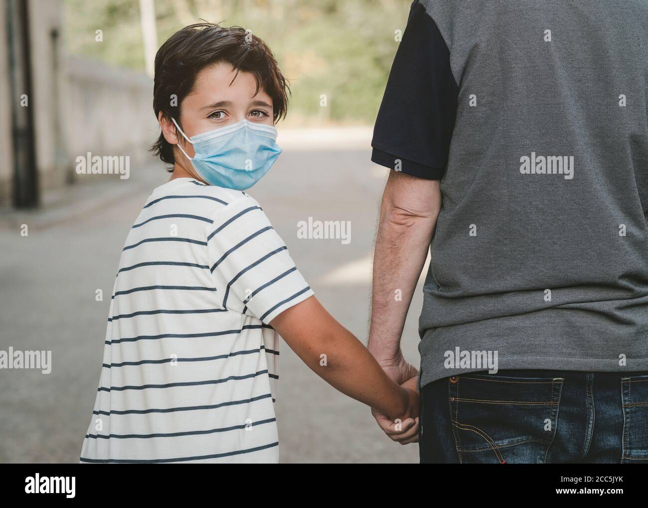 Dad holding kids hand hi-res stock photography and images - Alamy