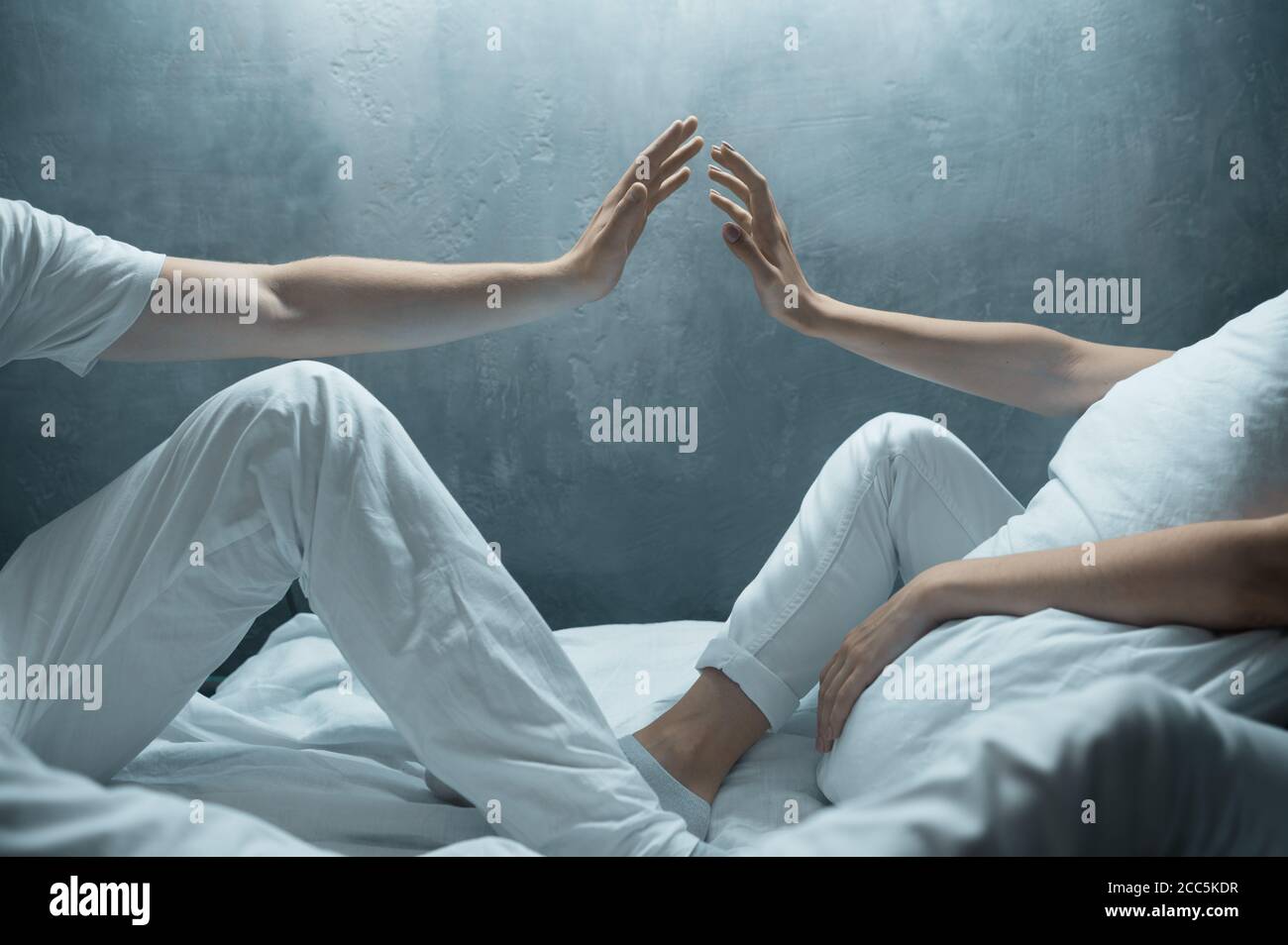 Crazy man and woman are sitting in bed, insomnia Stock Photo - Alamy