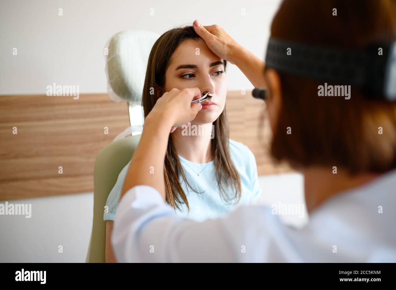 Female ent doctor and patient in office, exam Stock Photo - Alamy