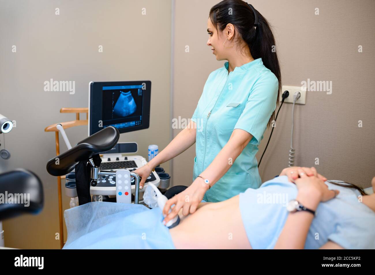 Female gynecologist makes ultrasound scan Stock Photo - Alamy