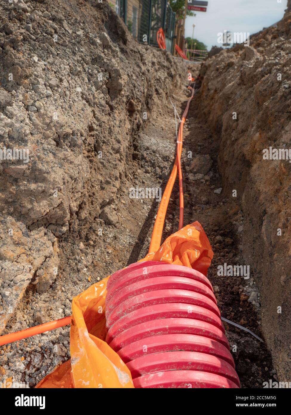 Data fiber optic cables in ribbed pipe under road. Wire in HDPE and ...