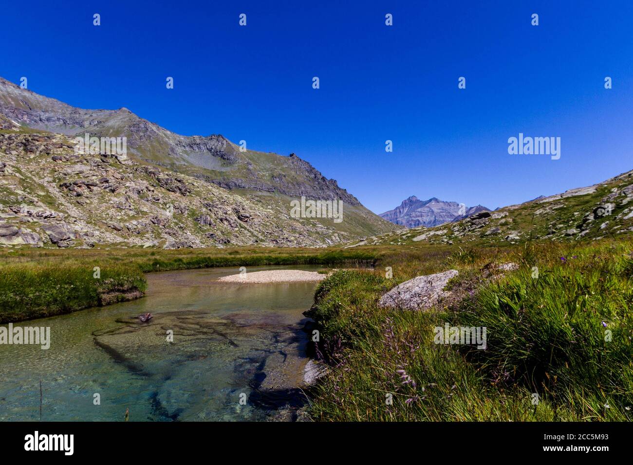 Clear water of the Alpine river in Gran Paradiso National Park Stock ...