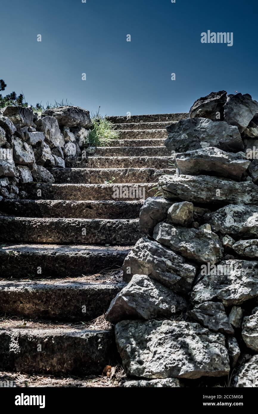 Steep Outdoor Stairs With Rock Steps Toward Blue Sky Stock Photo - Alamy