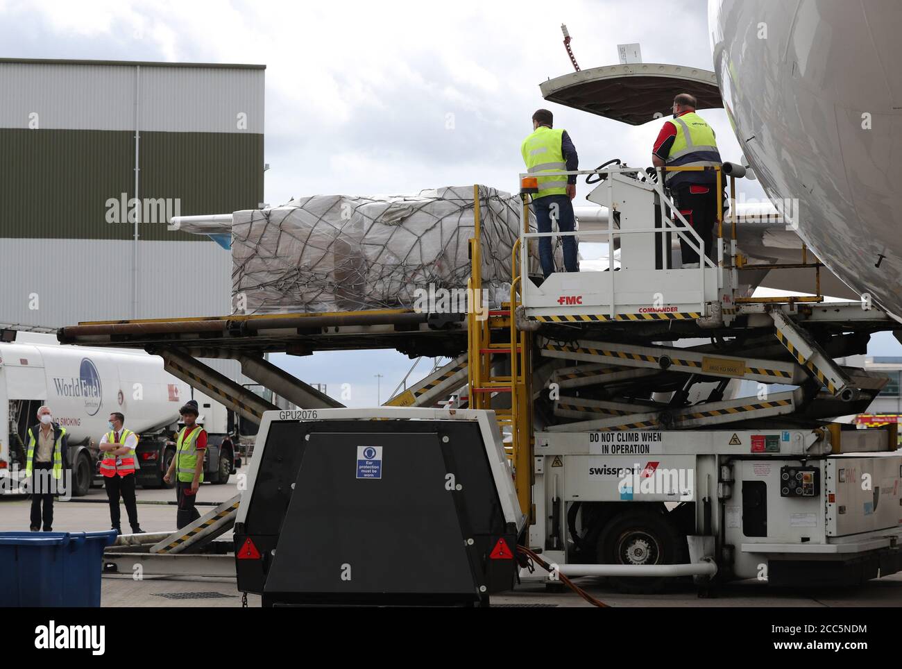 International development dfid logistician far left observes loading hi ...