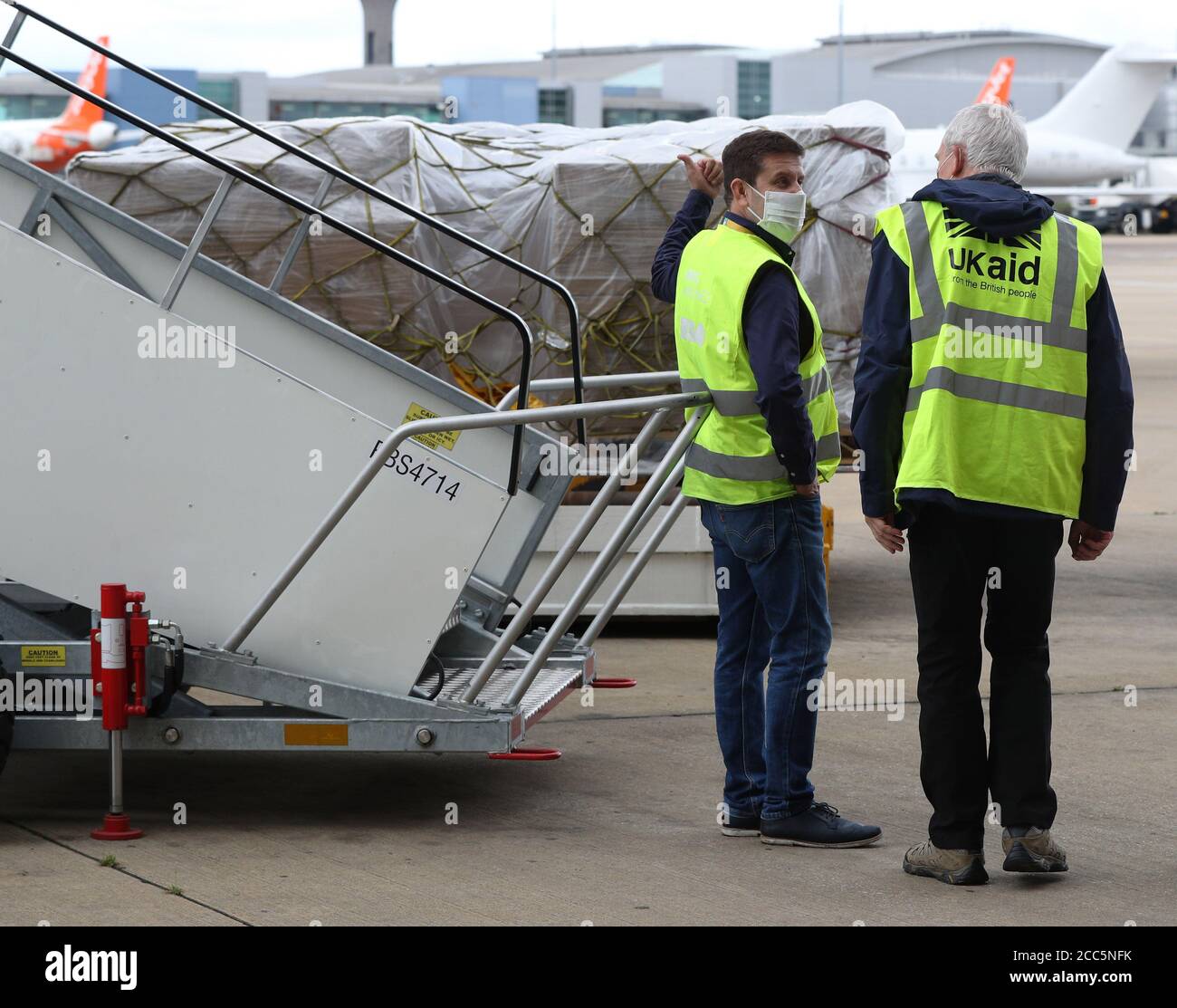 A Department for International Development (DFID) logistician (right ...