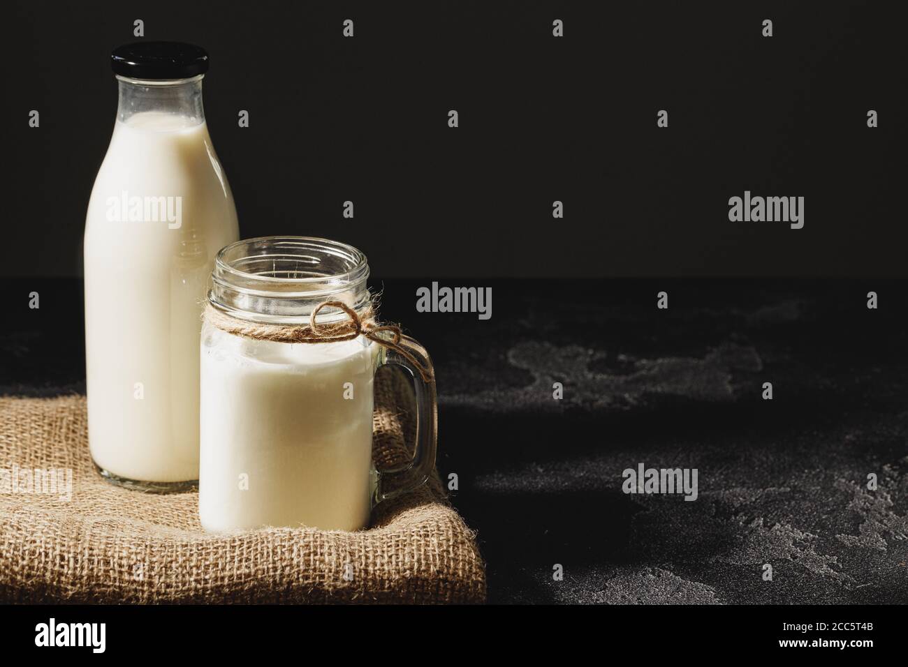 Bottle and glass of milk, front view Stock Photo - Alamy