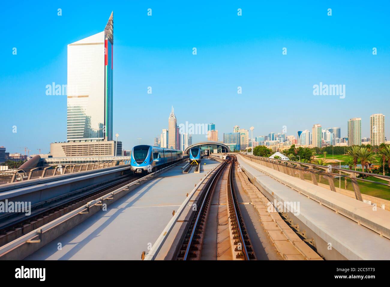 Dubai Metro train and Dubai city skyline in UAE Stock Photo - Alamy