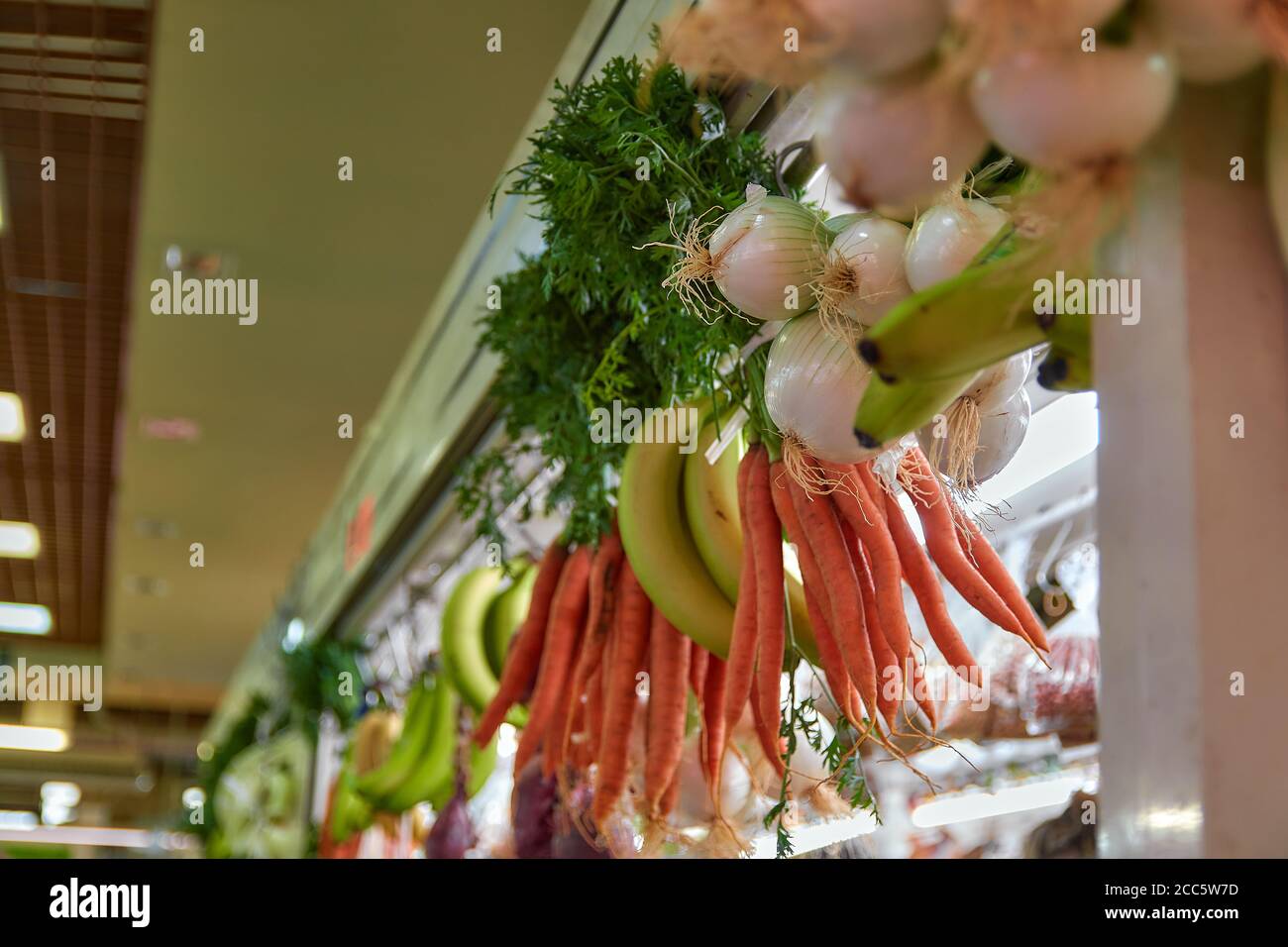 hanging carrots as exposition in vegetable sardinian fair Stock Photo ...