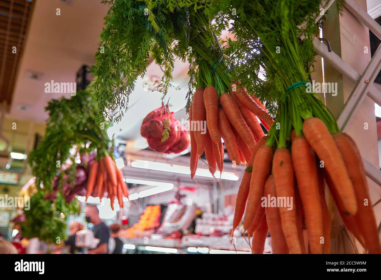hanging carrots as exposition in vegetable sardinian fair Stock Photo ...
