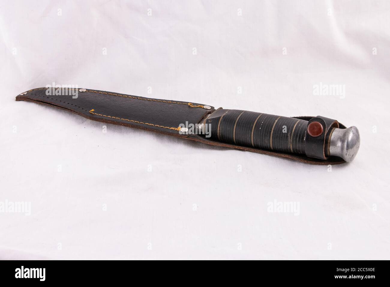 Dagger knife in sheath isolated on white Stock Photo - Alamy